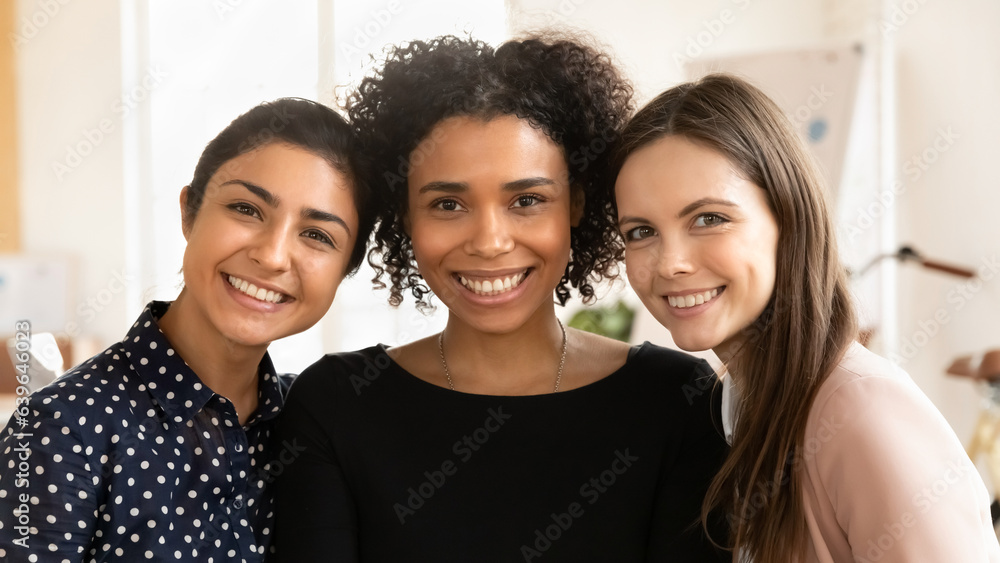 Close up portrait of smiling multiethnic women friends hug embrace ...