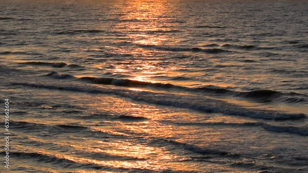 Sea water rippled waves with shiny reflection of beautiful colorful ...