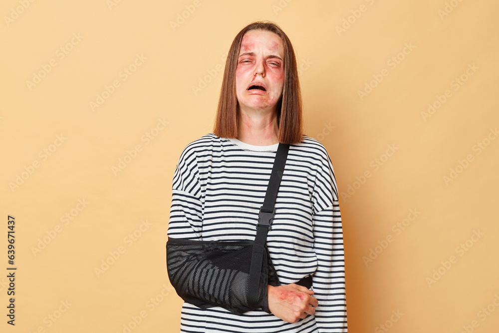 Despair sad unhappy woman with scratches and bruises on face with ...