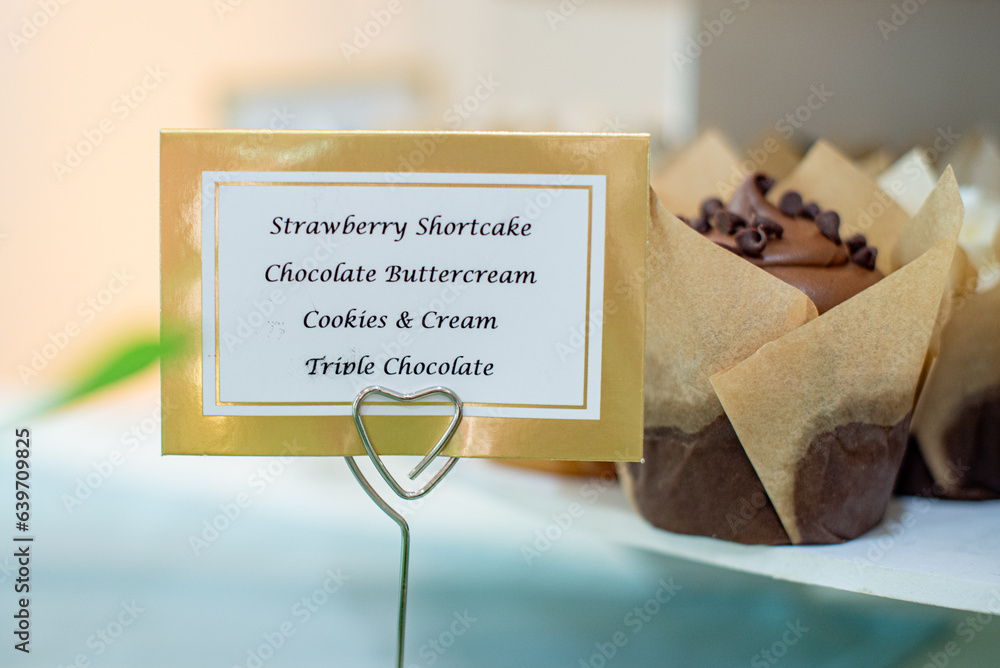 Gold and white label table dessert signs on heart rings that read ...