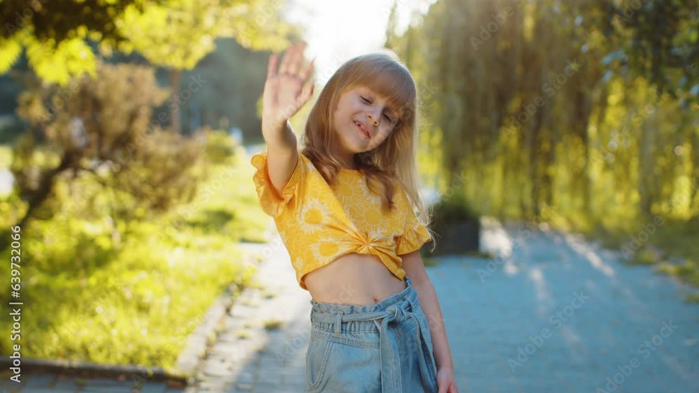 Preteen child kid smiling friendly at camera, waving hands gesturing ...