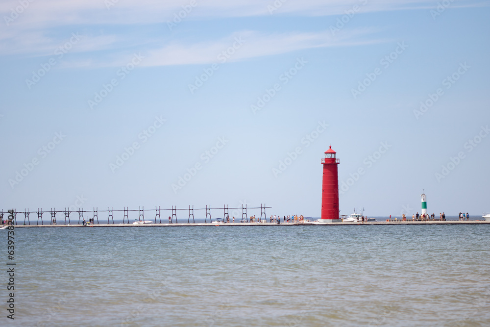 Lighthouse and pier on Lake Michigan at Grand Haven State Park in Grand ...