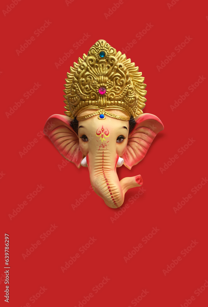Beautiful Ganesha statue head on bright red color background. Poster or ...
