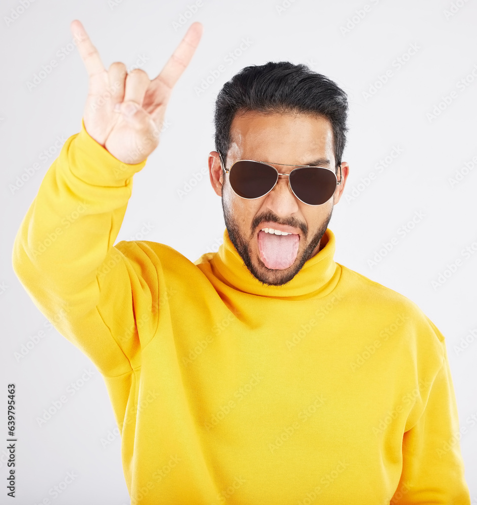 Man, horns and hand with sunglasses, studio portrait and rock icon for ...