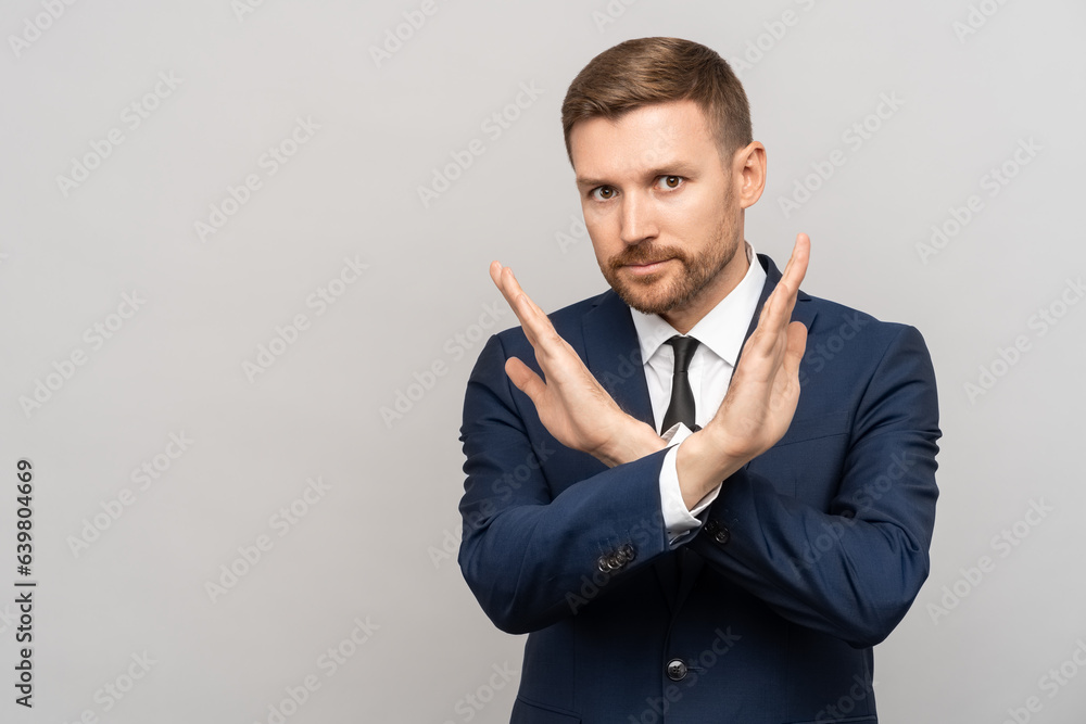 Interested serious businessman showing refuse hands gesture stop sign ...
