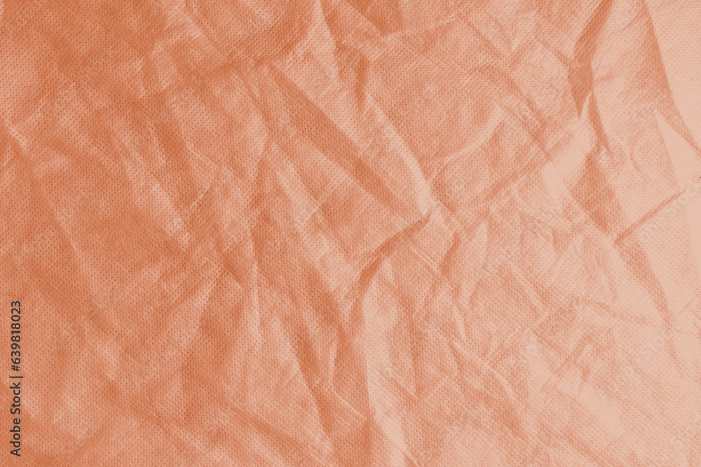 Wrinkled, crumpled orange fabric texture background. Wrinkled and ...