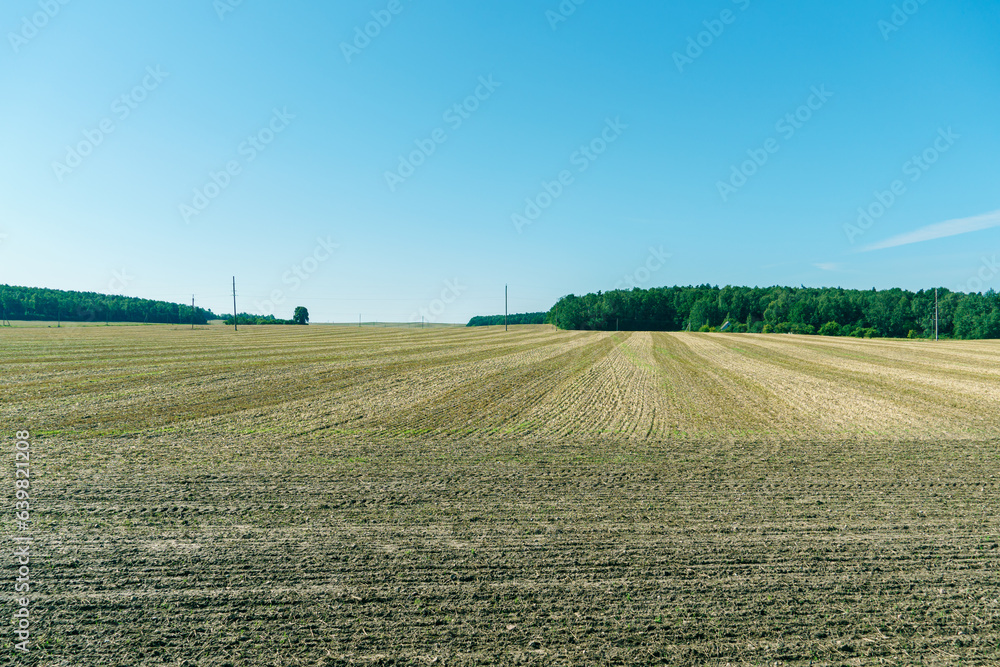 Deep furrows in the ground after working the tractor with the plow ...