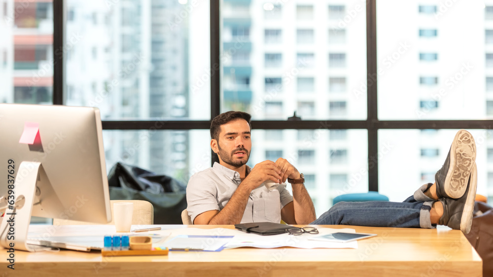 Businessman caucasian drinking coffee and relax after work hard. Man working and analysis report ...