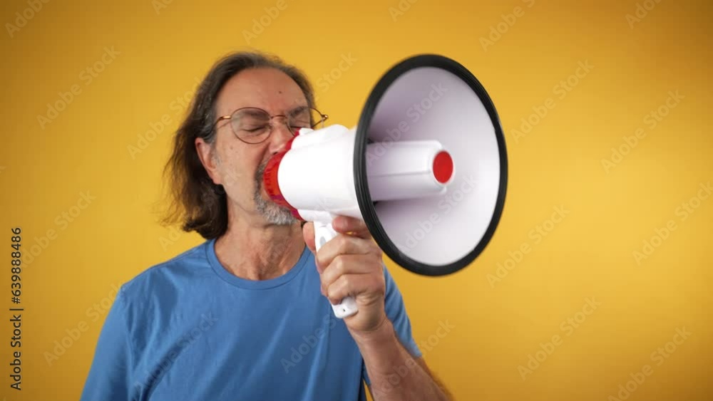 Wide angle, distorted portrait of mature man with glasses yelling into ...