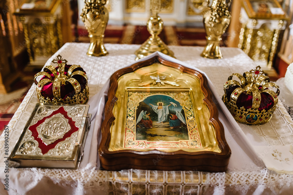 Wedding crowns. Wedding crowns and the Holy Bible decorated with gold ...