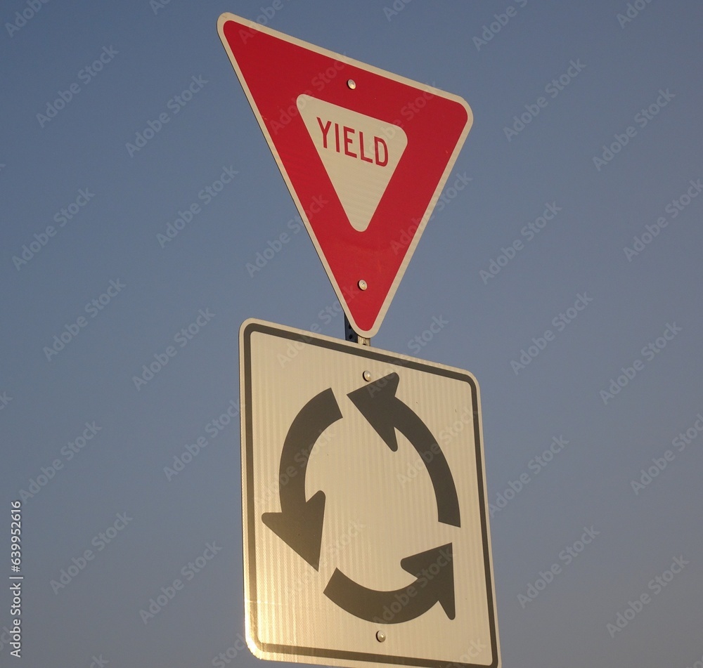 Yield sign with roundabout sign Stock Photo | Adobe Stock