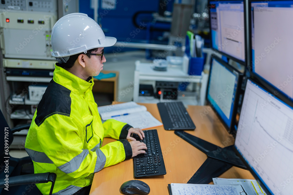 Inside the large Industry Factory Female Computer Engineer Works on ...