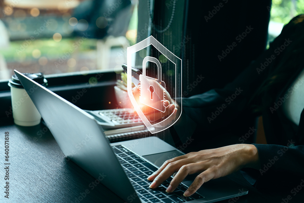 cybersecurity concept Businessmen protecting personal data on laptops and virtual interfaces ...