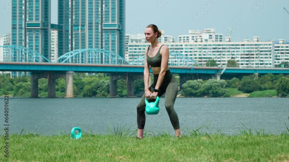 Fit Woman Athlete Doing Kettlebell Deadlift Workout In Hangang River ...