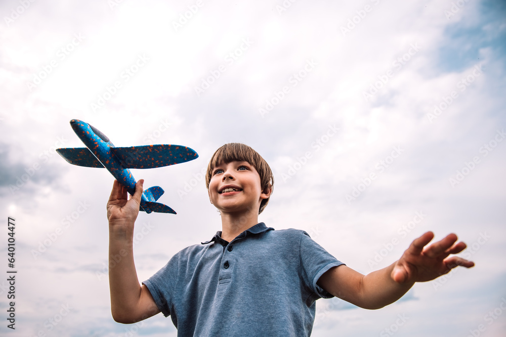 Happy boy child with toy plane. Boy kid playing aviator. Kid dream of ...