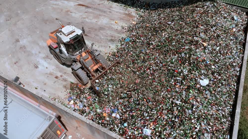 Forklift excavator is grabbing glass in warehouse, heavy-duty machine ...