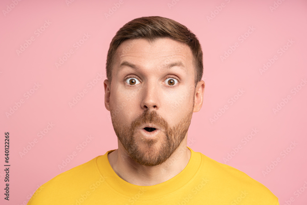 Amazed customer looks at camera in shock astonishment mouth open ...