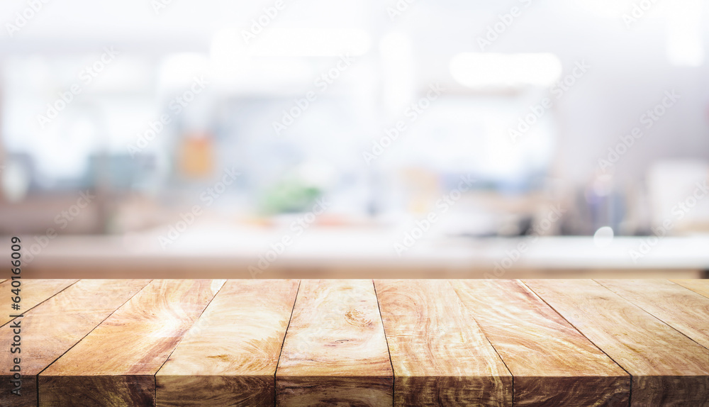 Selective focus.Wood table top on blur kitchen counter background.For ...