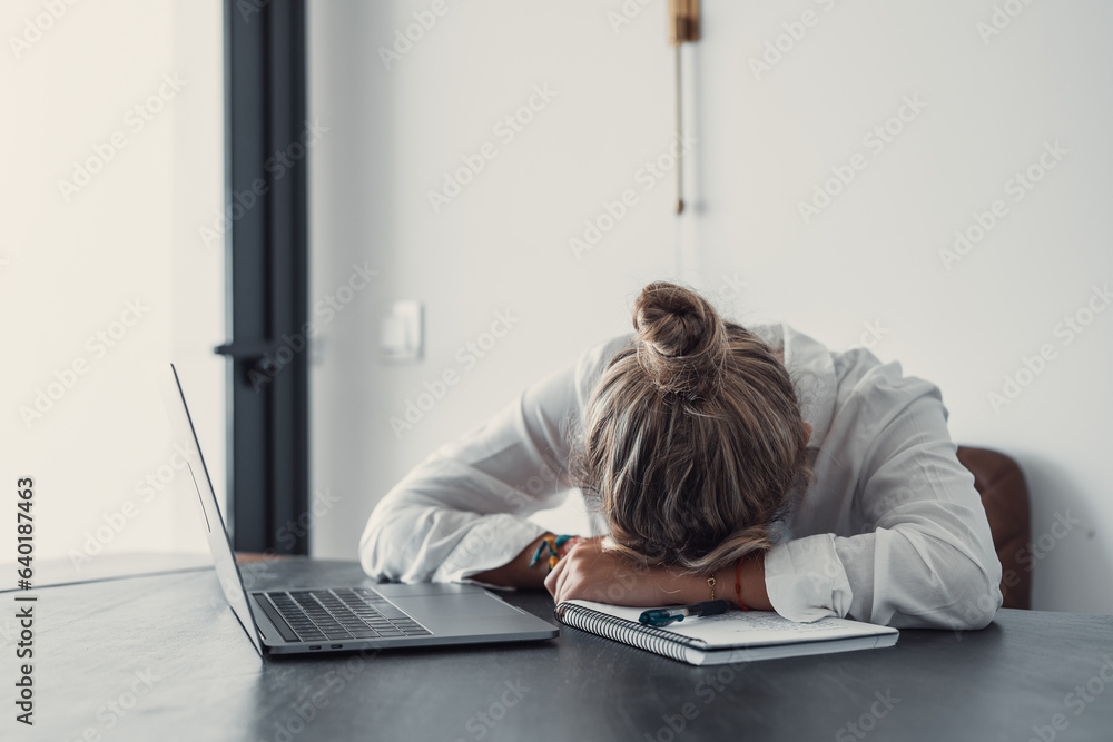 Exhausted young Caucasian female employee sleep desk at office overwork ...