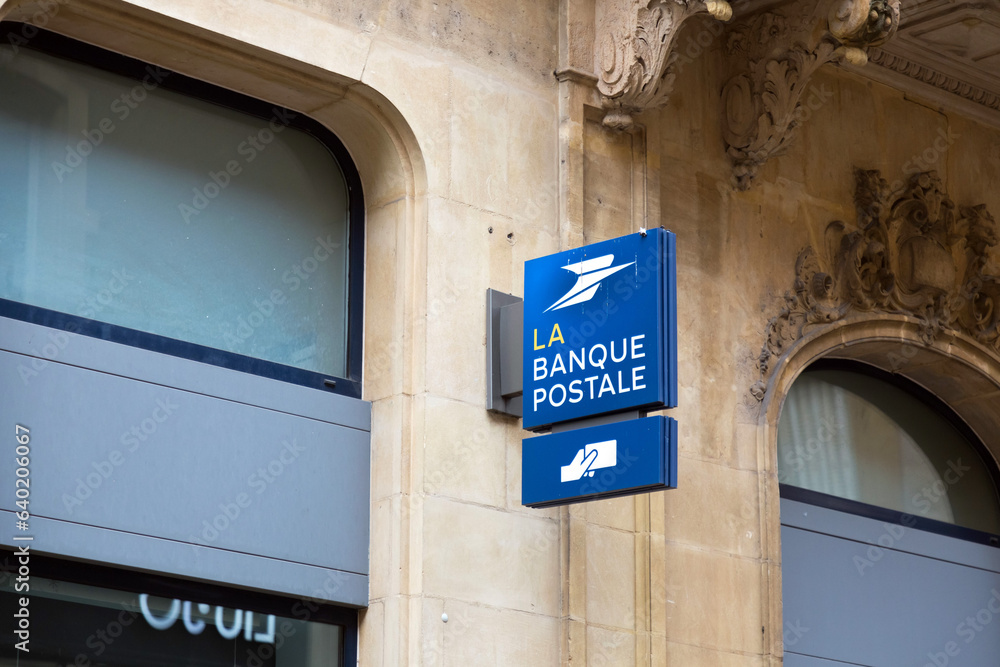 Entrance and signpost of French postal service and the Postal Bank in ...