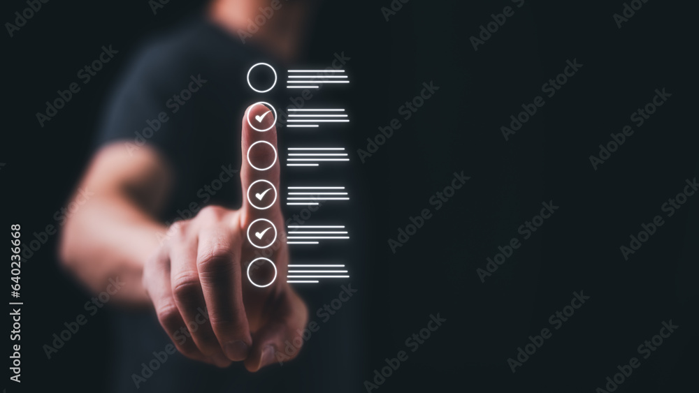 Foto de Businessman pressing to tick mark in checkbox for quality ...