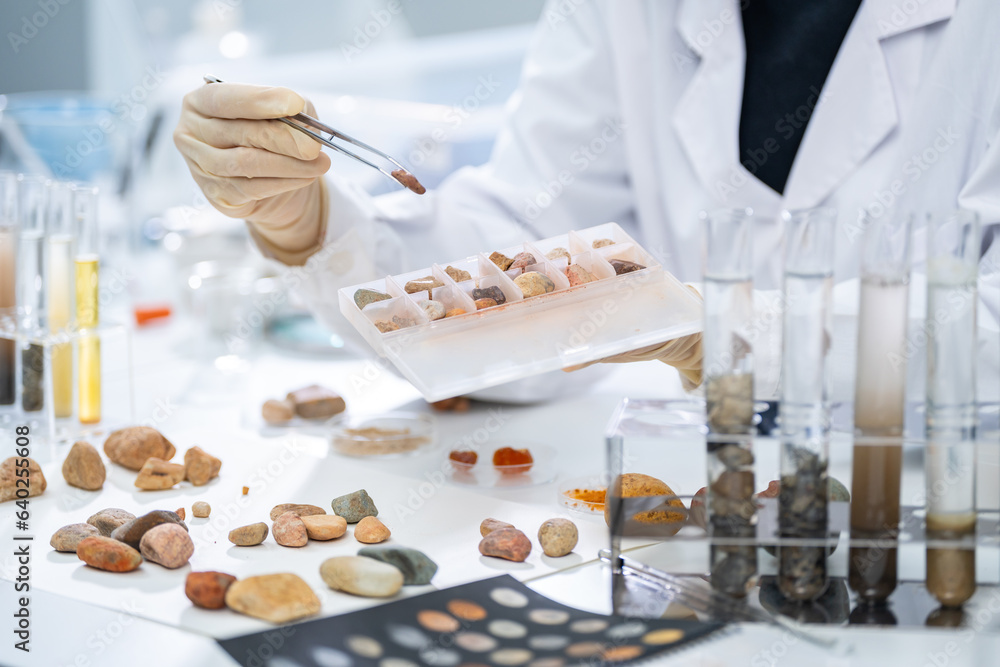 Rock sample in geology science laboratory research, mineral soil test ...