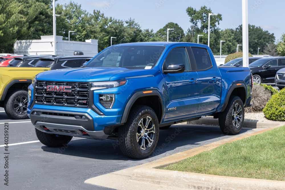GMC Canyon AT4 pickup display at a dealership. GMC offers the Canyon in ...