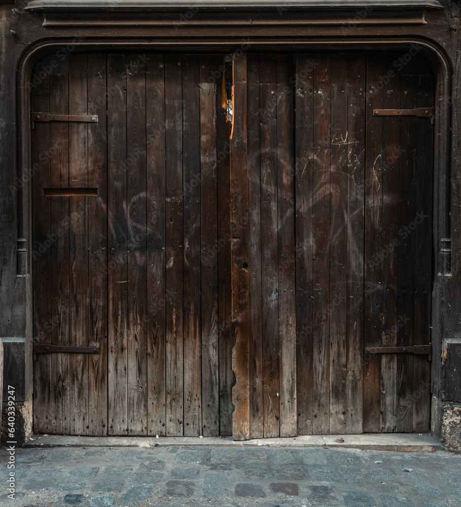 Large wooden gate. Entrance to a garage with two large wooden doors ...