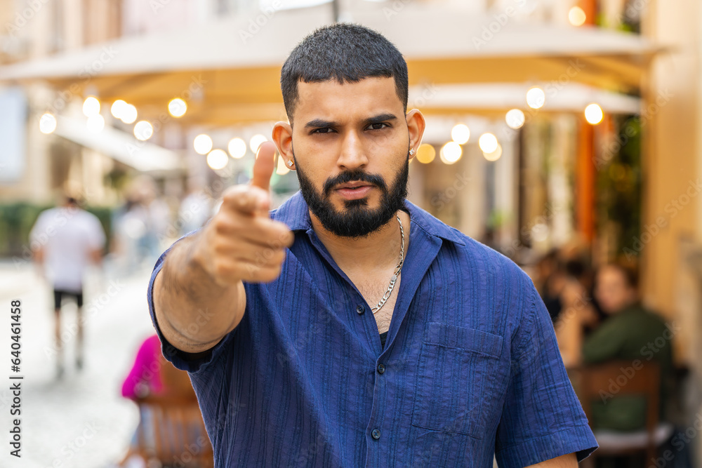 Angry adult indian man upset sad dissatisfied pointing with finger ...