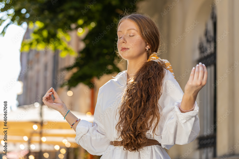 Keep calm down, relax. Teenager girl meditating, breathes deeply with ...