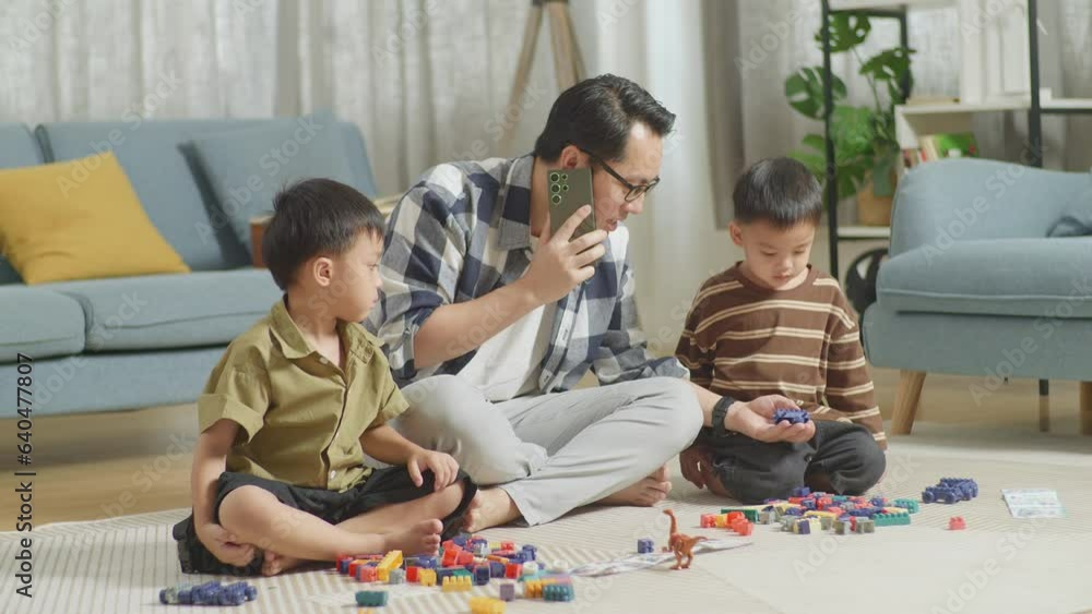 Full Body Of Asian Father And Sons Playing The Construction Set Colorful Plastic Toy Brick At ...
