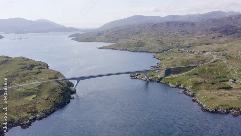 Dynamic drone shot of the bridge connecting the Isle of Scalpay to the ...