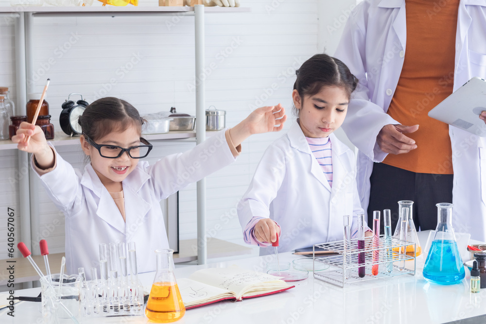 Group of multicultural students in lab coat uniform studying with ...