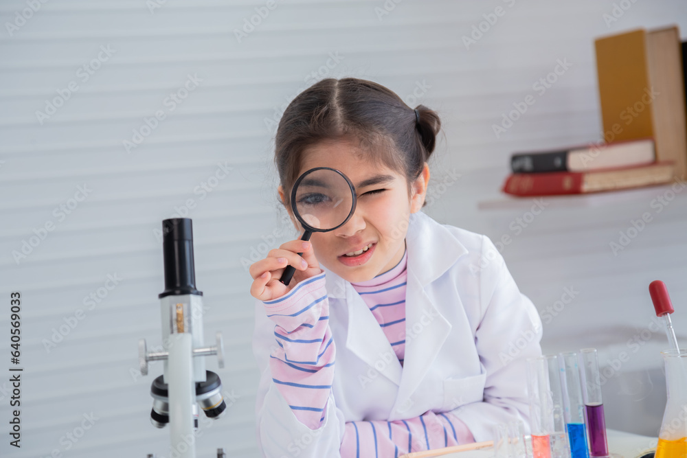 Cute Arabian girl elementary student kid wearing lab coat standing near ...