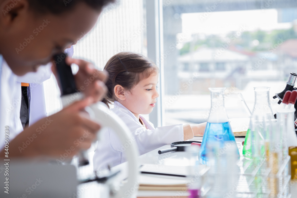 Selective focus group of multicultural African boy and elementary ...