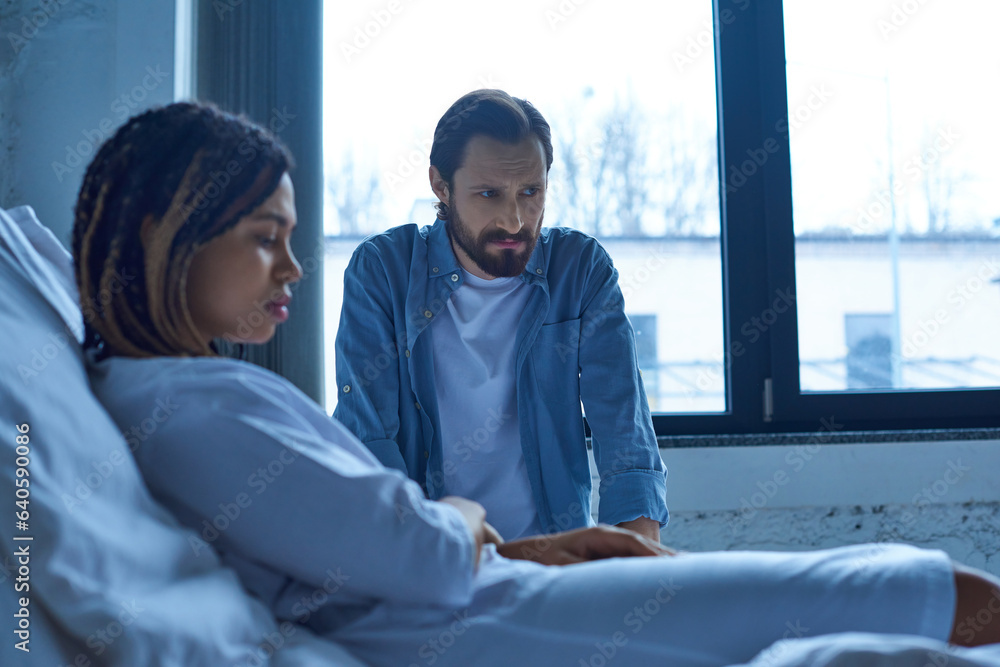 Miscarriage Man Sitting Near Depressed African American Woman Blur