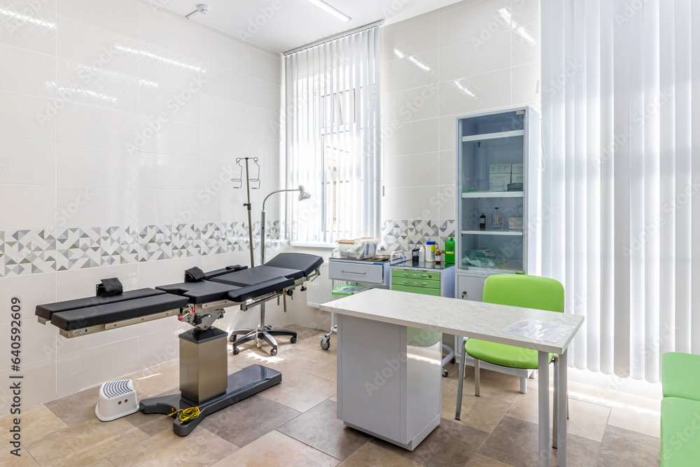 Modern medical office interior with doctor's workplace and examination ...