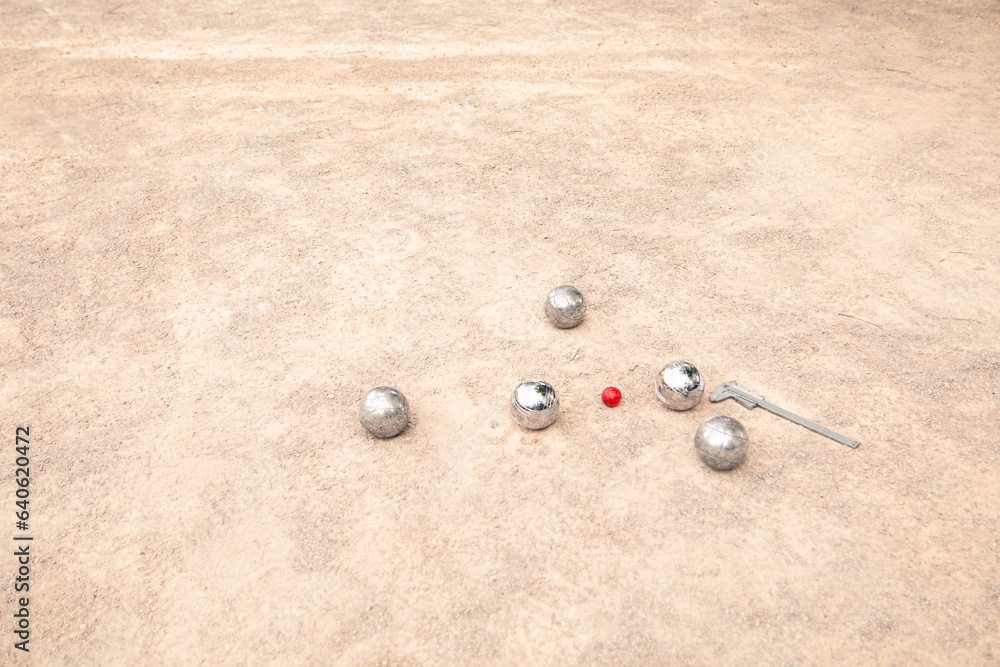 Game of pétanque on the ground, group photo of the balls. Dirt floor ...