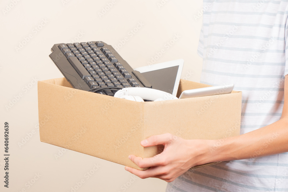 Donate technology to charity. Volunteer hands holding cardboard box with text old used laptop ...