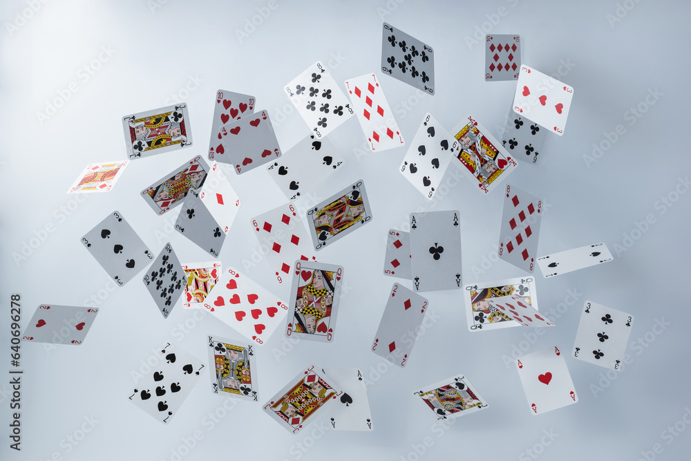 Falling playing cards on a white background. The concept of excitement ...