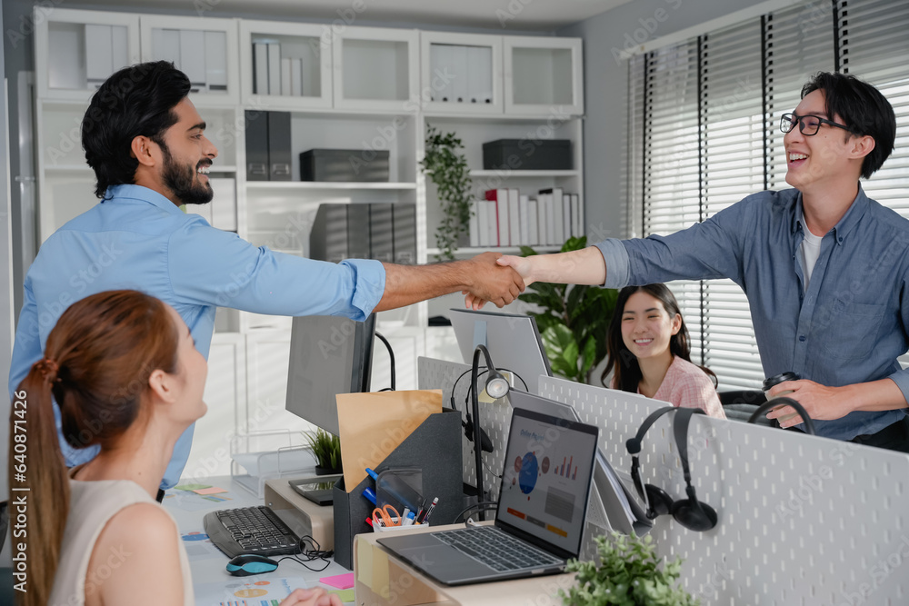 Meeting, partnership and business people shaking hands in the office ...