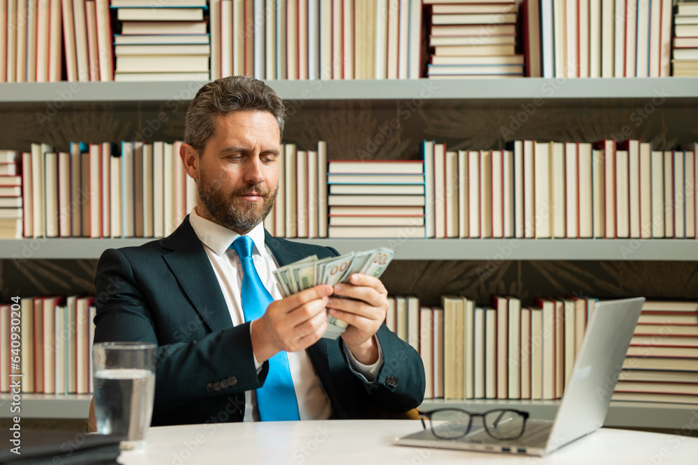 Successful business man counting money. Handsome middle age man holding ...
