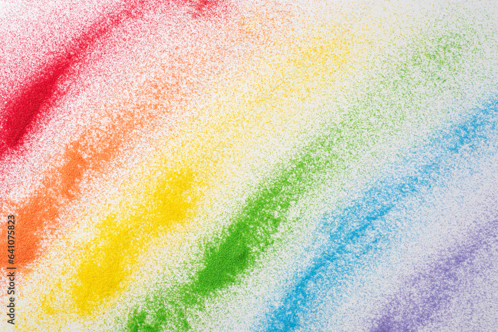 Rainbow sand flag signifies unity during LGBT history month. Top view ...