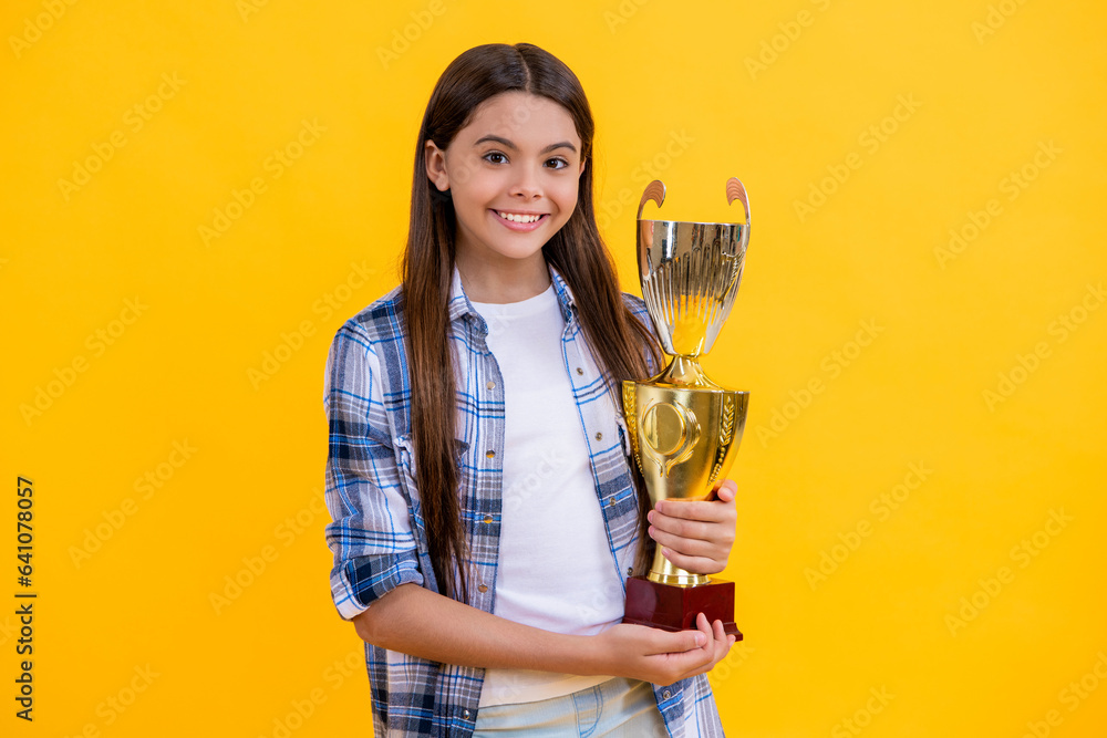 positive proud teen girl with champion cup award. teen girl hold her ...