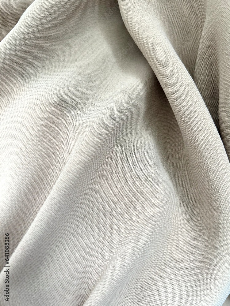 Grey fabric folds. Tissue folds. Smooth uniform grey fabric. Fabric ...