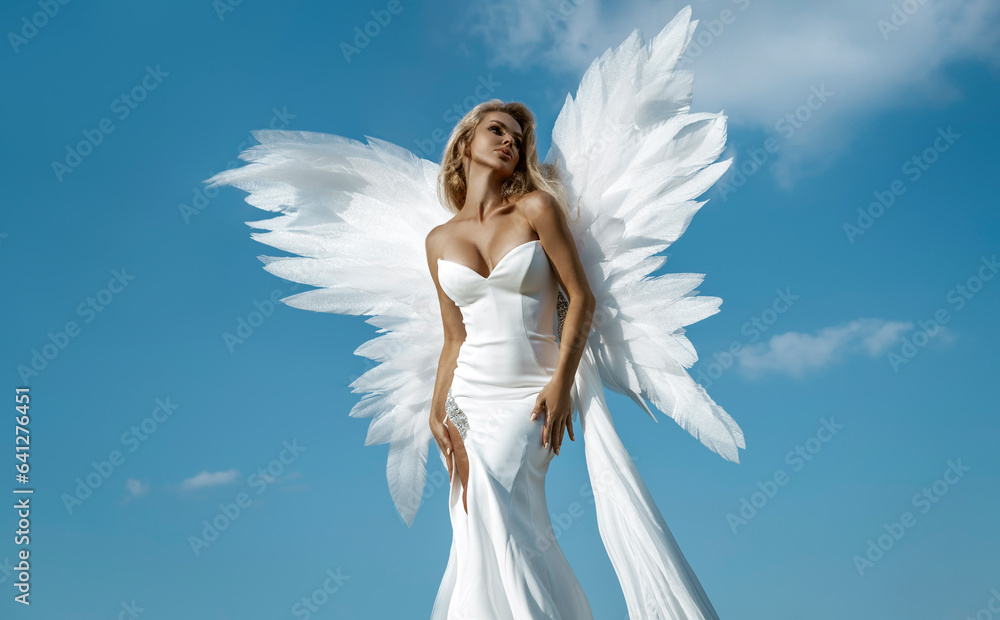 Beautiful Sexy Blonde Woman In White Long Elegant Dress And Angel Wings