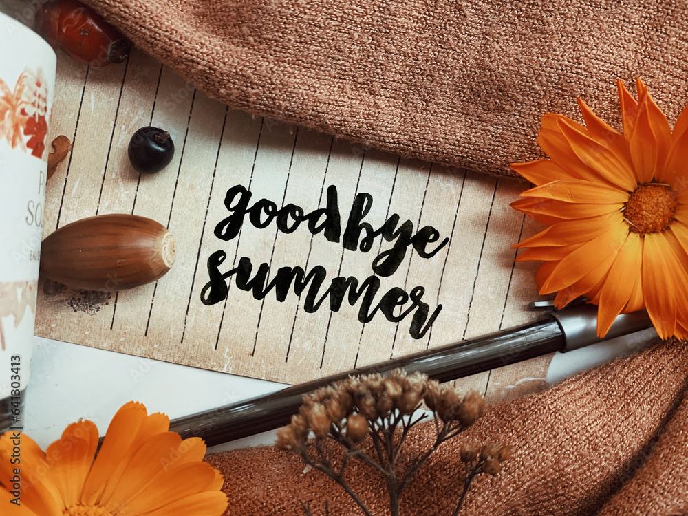 Goodbye summer handwritten style text on a paper page of notebook ...