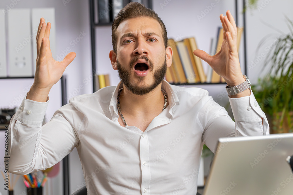 Excited amazed middle eastern businessman freelancer looking shocked ...