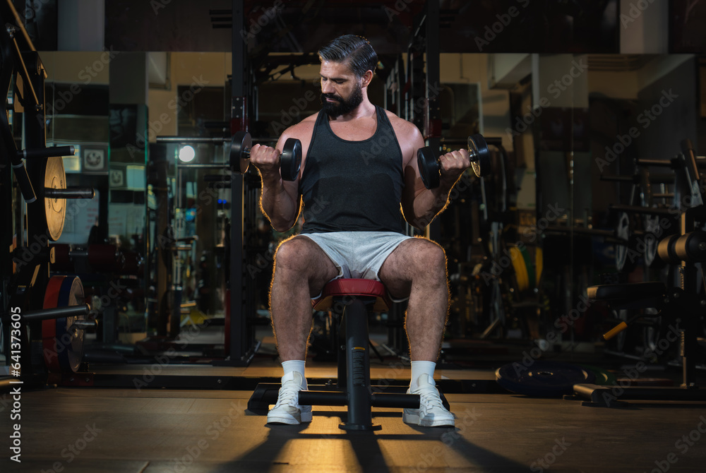 handsome muscular caucasian man concentrated lifting dumbbell weight ...