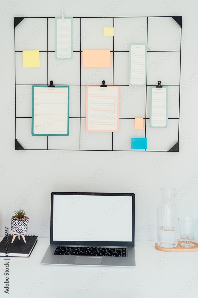Modern workplace - white desk with laptop mockup empty screen, grid ...